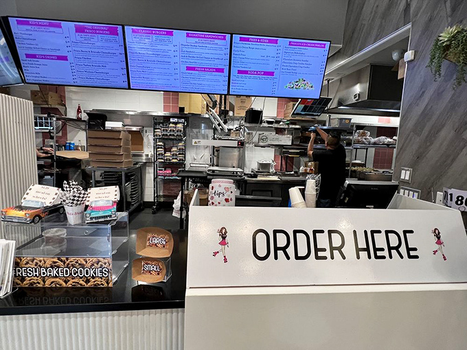 The counter where dreams begin, freshly baked cookies tempting you before you've even ordered. Resistance is futile, and honestly, why bother?