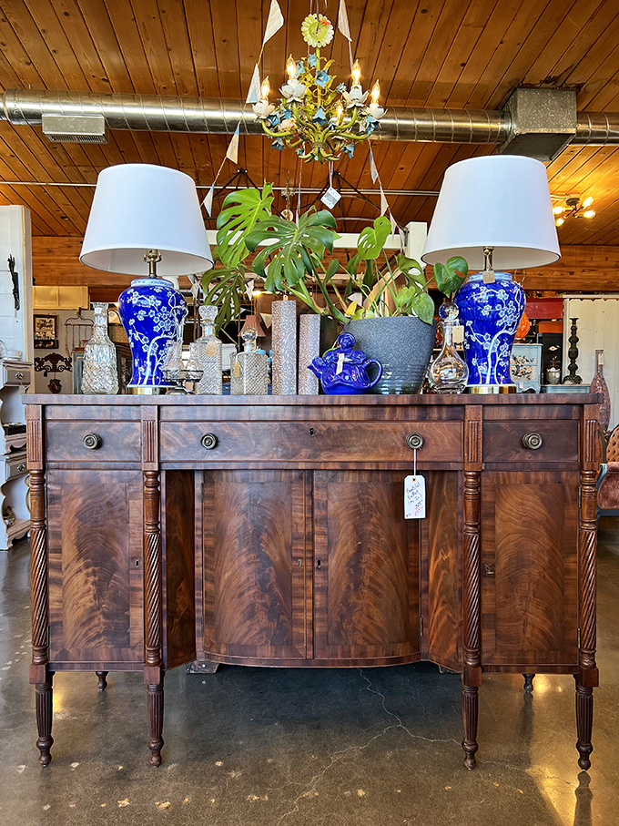 This mahogany sideboard with its rich wood grain and classic lines proves quality craftsmanship never goes out of style. Those blue and white lamps add the perfect pop of color.