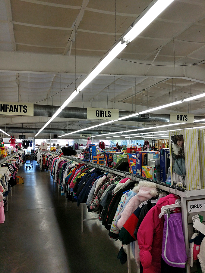 The children's section, organized with military precision. Those tiny jackets hold big possibilities for growing families on budgets.