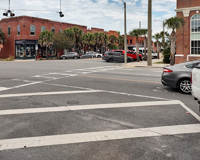 Brick buildings and palm trees frame Apalachicola's downtown intersections, where stopping to chat isn't holding up traffic &ndash; it's practically required.
