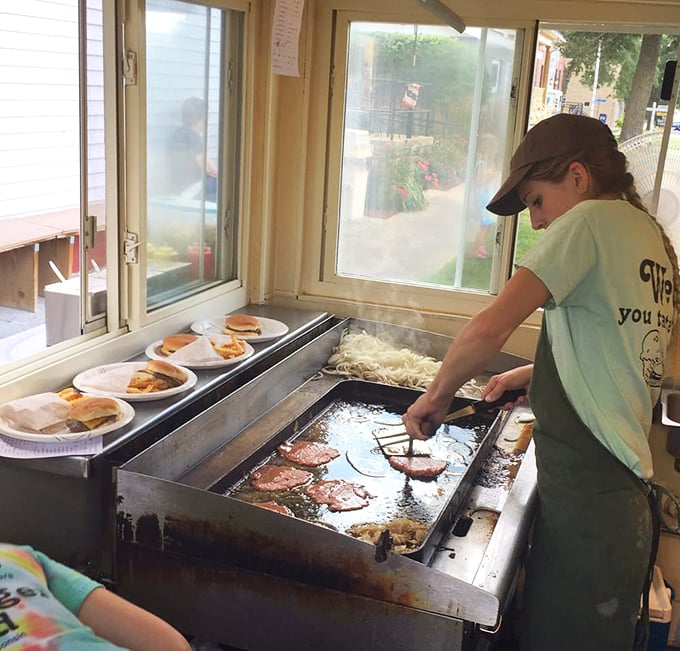 Where the magic happens—watch as thin patties sizzle in butter, developing that signature crispy edge that butter burger dreams are made of.