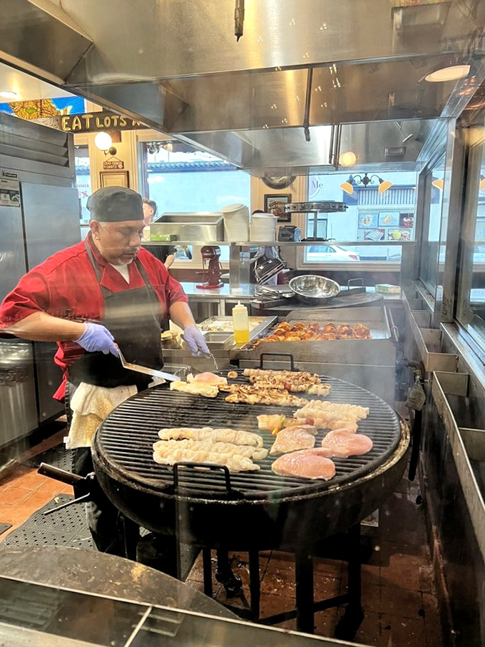 Where the magic happens: an open kitchen with seafood sizzling on the grill, proving simplicity is the ultimate sophistication.