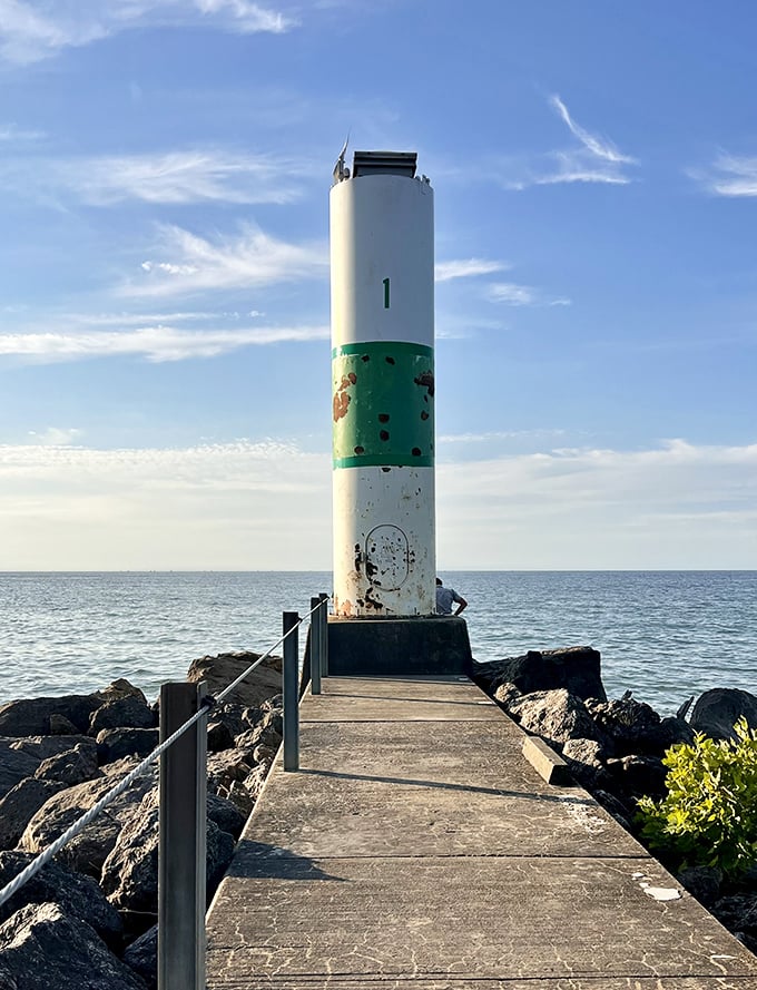 Standing sentinel where land meets lake, this weathered lighthouse has guided countless vessels and appeared in thousands of visitor selfies.