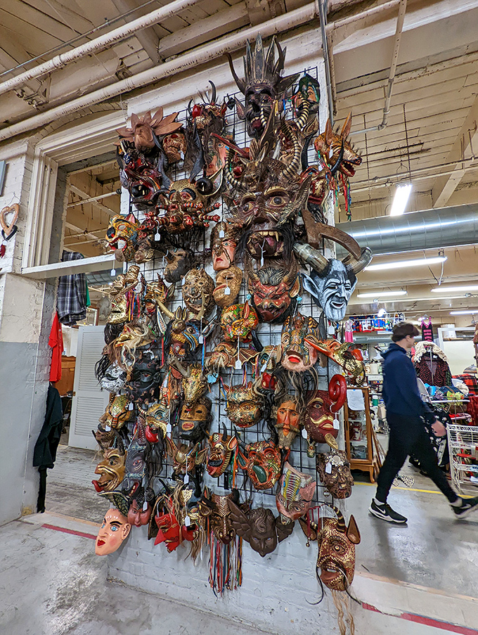 A wall of masks that stare back at you with hollow eyes, each one silently asking, "Am I creepy enough to hang in your guest bedroom?"    
