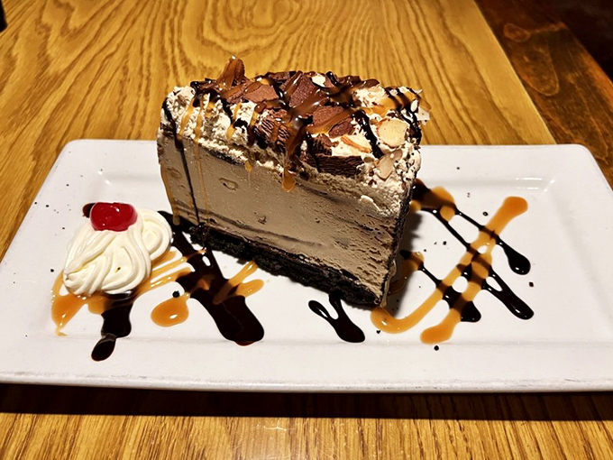 Mud pie finale towers with chocolate decadence, the sweet ending every steakhouse meal deserves completely.