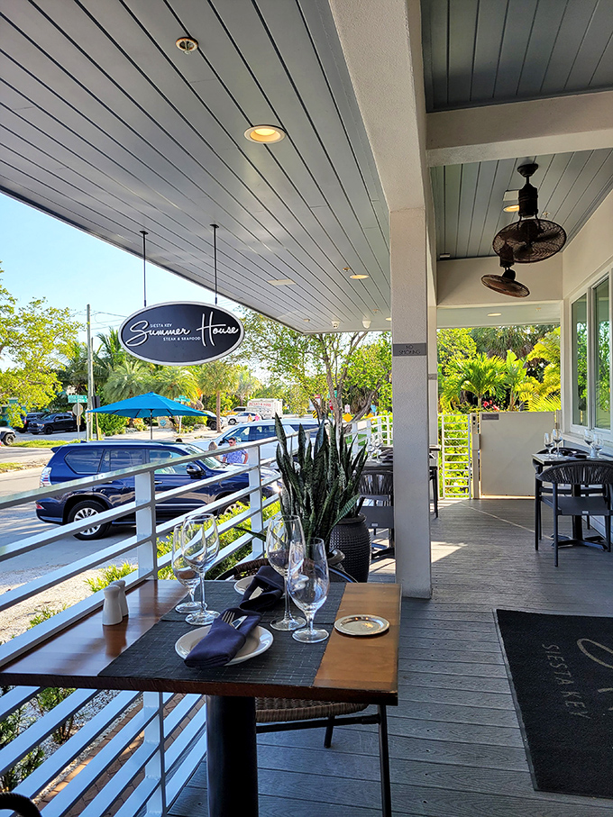 Outdoor seating that captures Florida's essence&mdash;palm-framed views, gentle breezes, and tables set for memorable meals under blue skies.