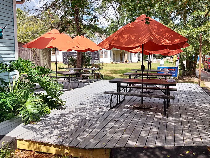 LaLou's outdoor seating area, where pancakes taste even better under the dappled shade of Louisiana trees.
