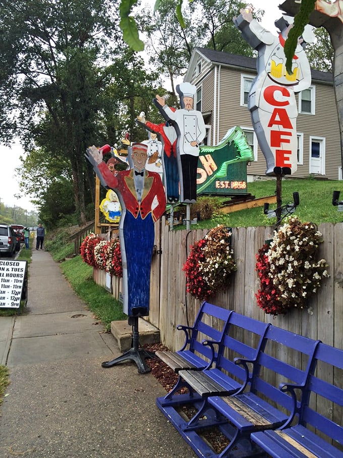 Blue benches and vintage figures stand guard outside, welcoming hungry pilgrims to this temple of comfort food. The flowers add a touch of "we're fancy, but not too fancy."