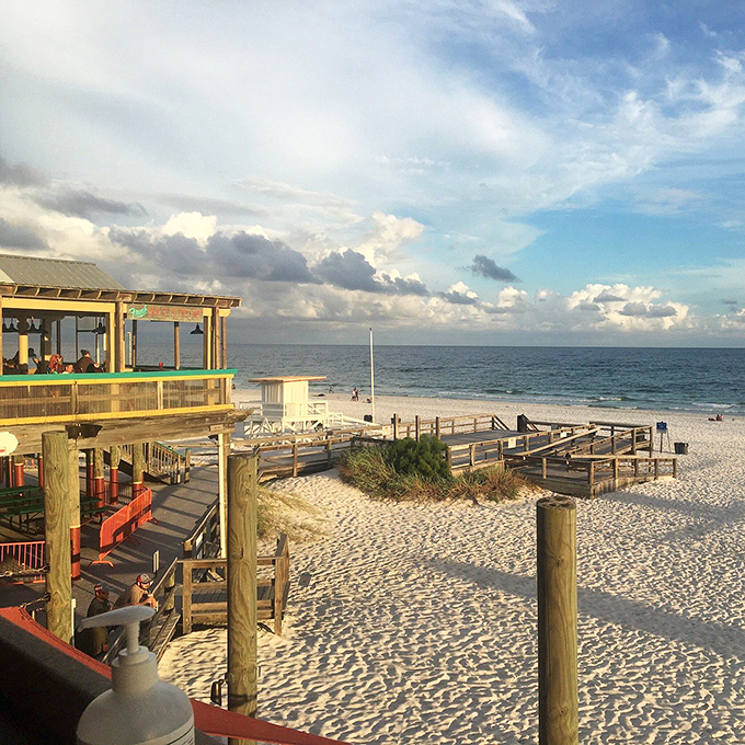 Where the restaurant meets the beach, creating that perfect moment when you realize flip-flops were absolutely the right footwear choice.