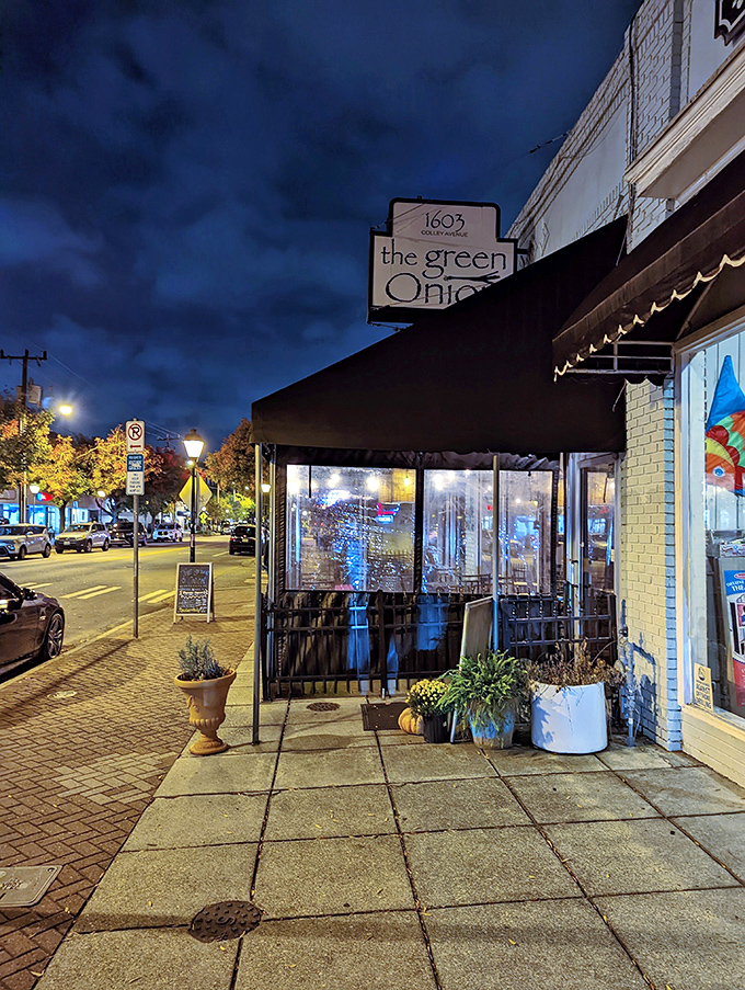 As night falls, The Green Onion glows like a lighthouse for hungry souls navigating the streets of Norfolk's Ghent neighborhood.