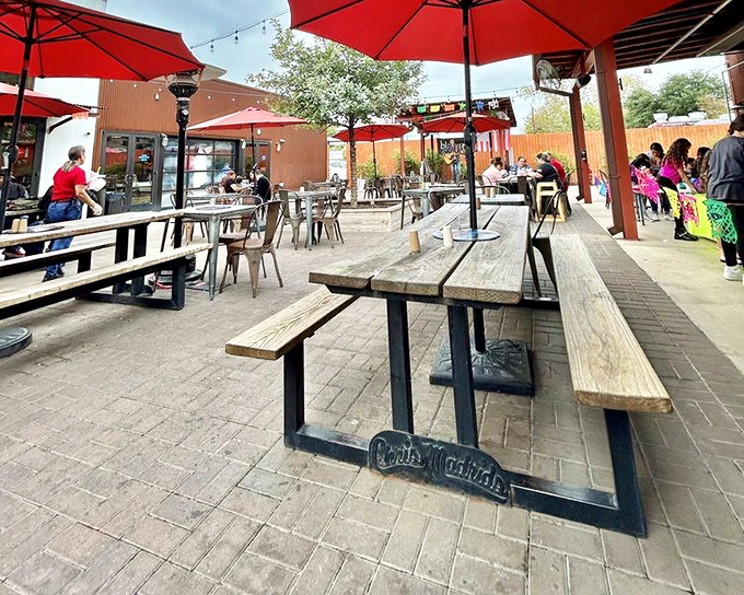 Red umbrellas provide shade while you contemplate the important things in life, like whether to order another Tostada Burger or save room for dessert.
