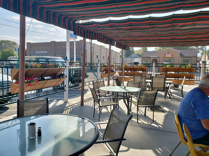 The outdoor patio offers fresh air with your fresh food. Those striped awnings provide shade for serious eating business.