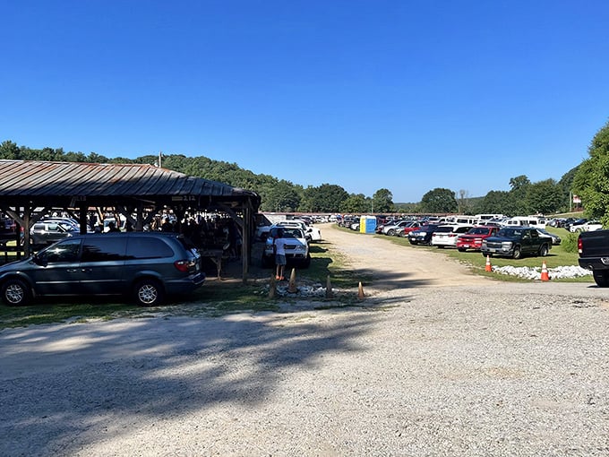 The pilgrimage begins here. Cars line up in the early morning light, filled with shoppers armed with cash, comfortable shoes, and unlimited optimism.