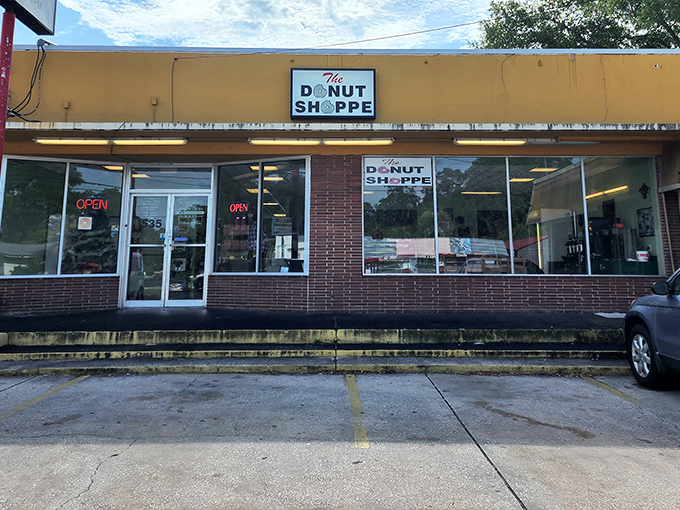 The view from the parking lot—where anticipation builds and the aroma of fresh donuts begins to work its magic before you even exit your car.