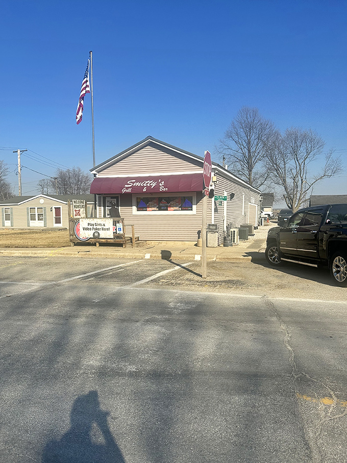 Under clear Illinois skies, Smitty's stands proudly with its American flag—a small building housing enormous flavors and even bigger heart.