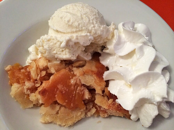 Not just dessert&mdash;it's an edible hug. This peach pie with ice cream and whipped cream is why elastic waistbands were invented.