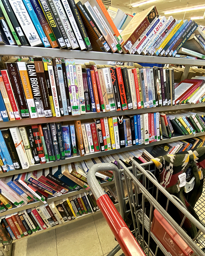 Books tilted at precarious angles, like literary dominoes waiting to tumble into your cart and then your home library.