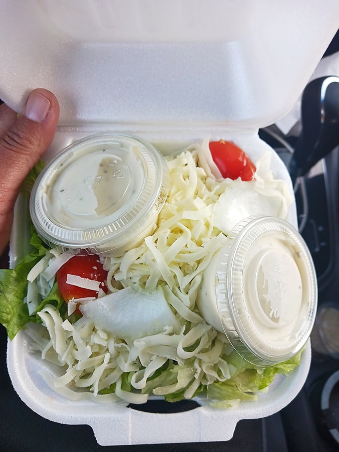 A salad that knows its role in the pizza ecosystem &ndash; fresh, crisp, and ready to ease your conscience before the main event.