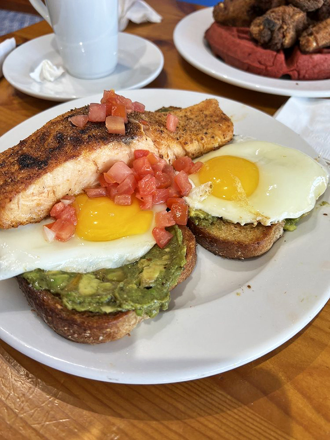 Avocado toast gets the royal treatment with perfectly cooked salmon and sunny-side-up eggs&mdash;proof that trendy can also be transcendent.