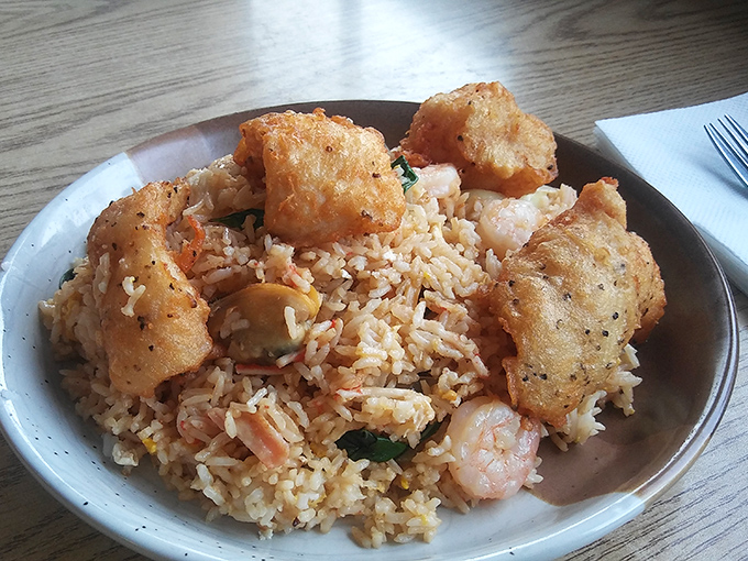 Fried rice that refuses to be a mere side dish. Studded with seafood and topped with crispy morsels, it demands&mdash;and deserves&mdash;center stage.