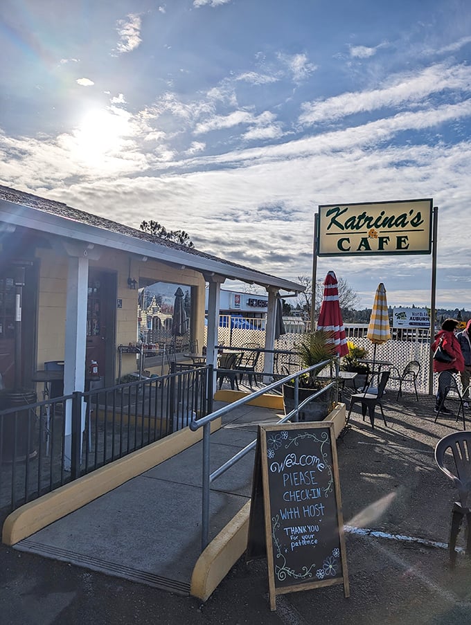 Morning light bathes the Katrina's sign in golden possibility. This isn't just a caf&eacute; entrance&mdash;it's the gateway to your next favorite meal.