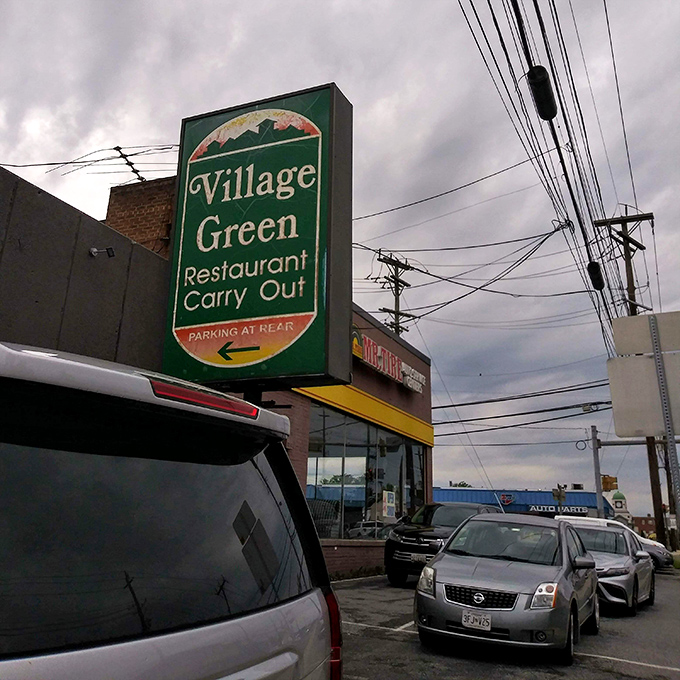 The street sign promises both restaurant dining and carry-out options&mdash;because sometimes you want your breakfast sandwich in your car, judgment-free.