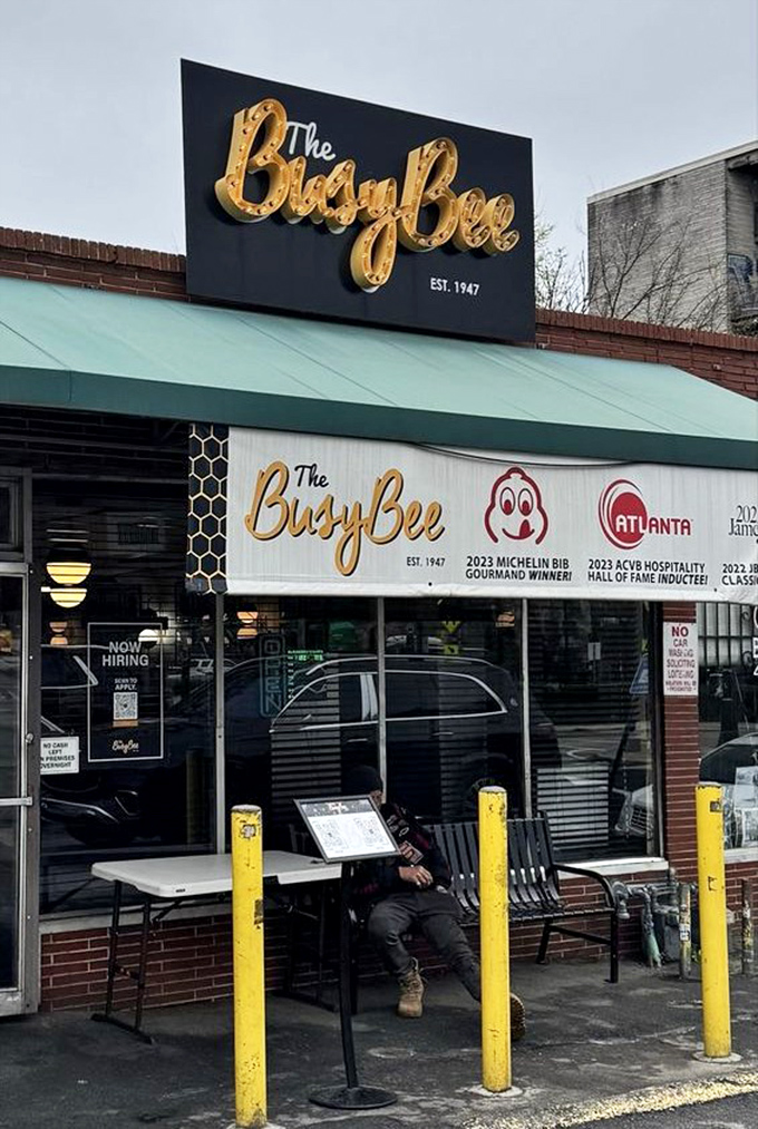 Awards proudly displayed like battle honors. The 2023 Michelin Bib Gourmand winner's sign tells newcomers what regulars have known for decades—this place is the real deal.