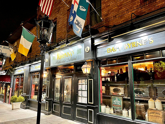 By night, the fa&ccedil;ade transforms into a beacon of conviviality, flags fluttering above like a United Nations of good times.