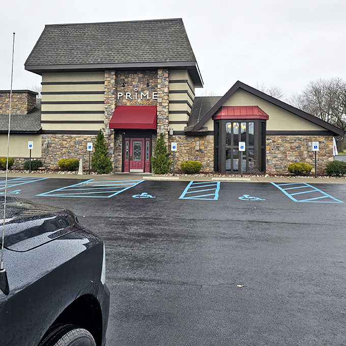 From this unassuming parking lot, culinary adventures begin. The stone facade hints at the rustic elegance waiting inside Prime Steak House.
