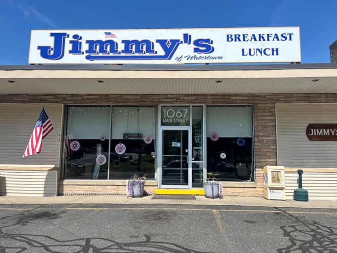 Jimmy's storefront stands ready for another day of feeding Watertown. That American flag isn't just decoration&mdash;it's a promise of classic diner tradition.
