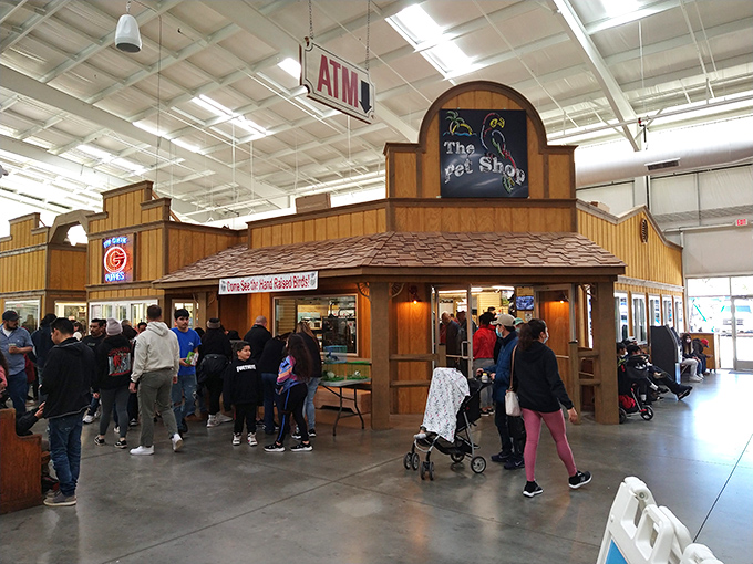 Western-themed storefronts within the market create a shopping town under one roof. Even the ATM looks like it belongs in a frontier settlement.
