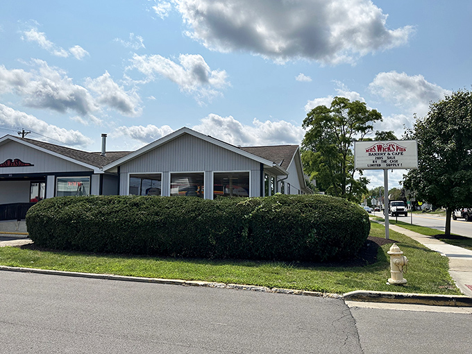 The roadside sign stands as a beacon to hungry travelers. In pie we trust—and in Mrs. Wick's we find salvation.