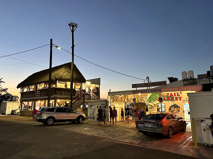 As the sun sets, Keys Fisheries transforms into a glowing beacon for hungry travelers. The best meals often happen when day surrenders to night.