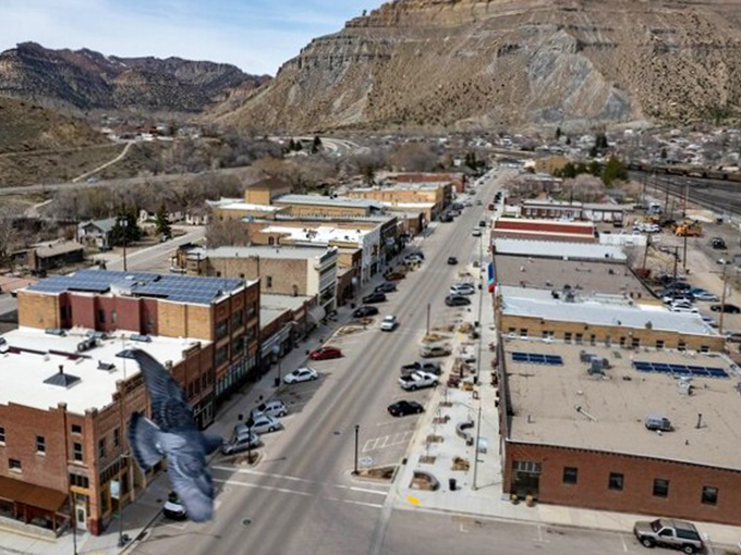 From above, Helper reveals itself as a perfect ribbon of civilization nestled between geological giants, a testament to human perseverance.