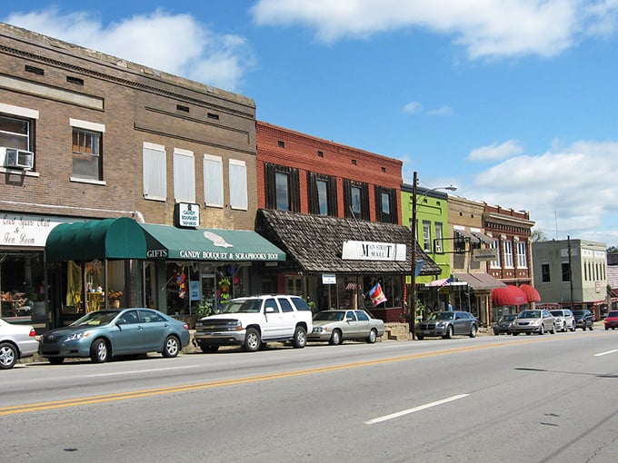 Main Street businesses painted in complementary colors create a welcoming streetscape that invites exploration of local shops and eateries.