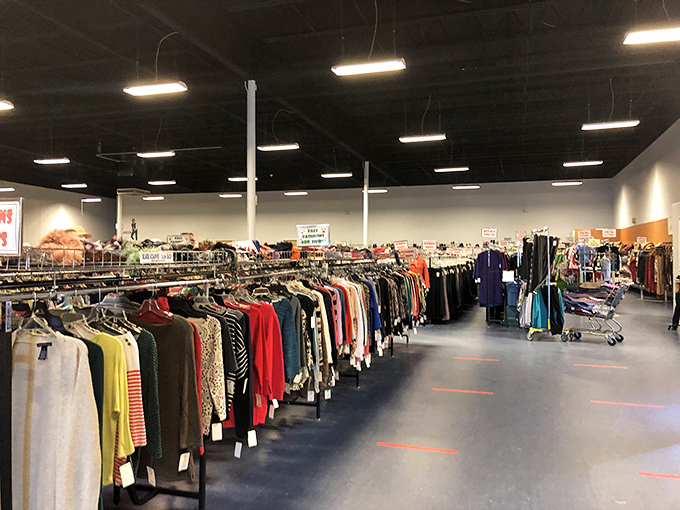 Racks upon racks of possibility. In this sea of secondhand clothing, patience reveals designer labels hiding among the everyday items.