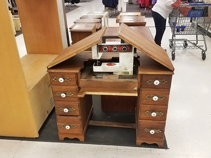 A vintage sewing desk reveals its hidden Singer&mdash;a wooden time capsule from when "handmade" wasn't just a premium Etsy category.