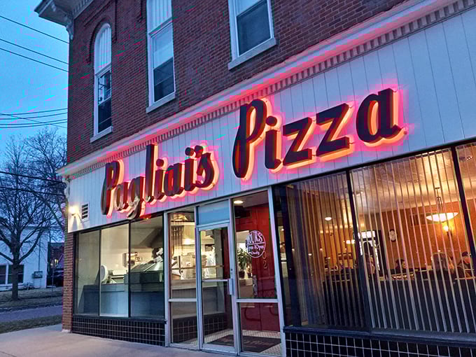 The iconic neon glow of Pagliai's Pizza sign &ndash; a beacon of hope for the hungry souls of Iowa City.