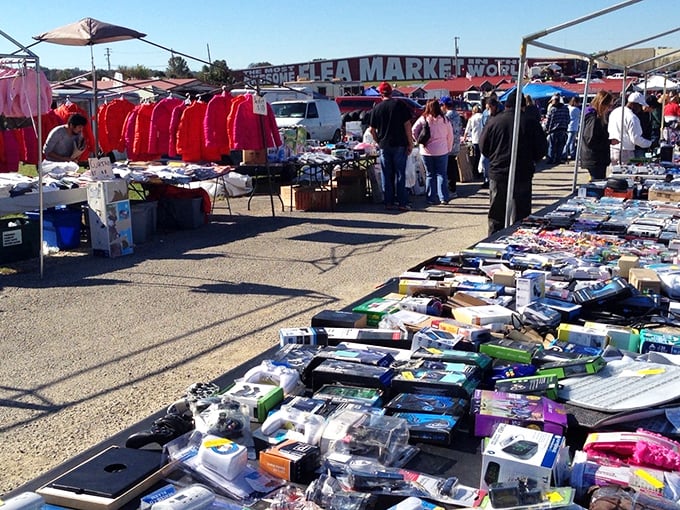 Treasure hunters paradise! The Awesome Flea Market's outdoor section buzzes with colorful tents and tables loaded with potential finds.