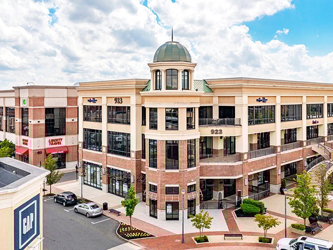 A modern shopping complex with that distinctive dome on top - suburban paradise with big city shopping vibes!