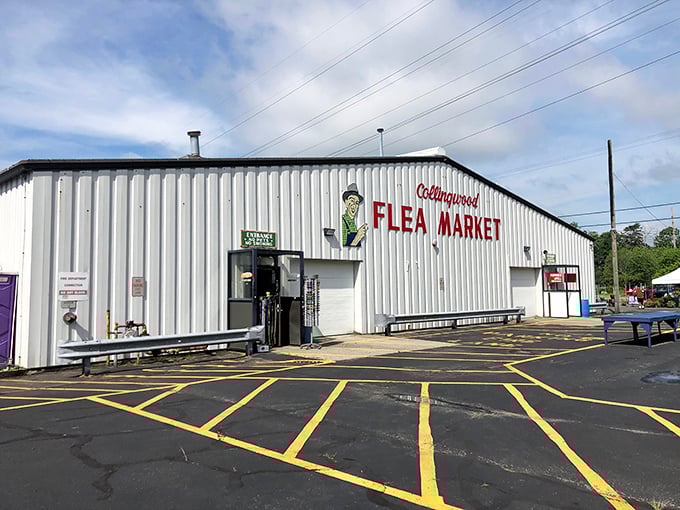 The iconic Collingwood Flea Market building stands ready for treasure hunters. Like a white-walled fortress guarding untold bargains within!