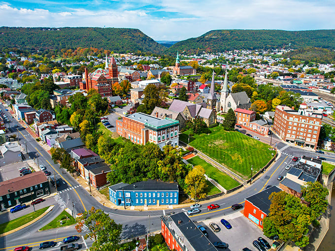 Cumberland's aerial view showcases nature's perfect embrace &ndash; mountains cradling a historic downtown like a treasure in velvet.