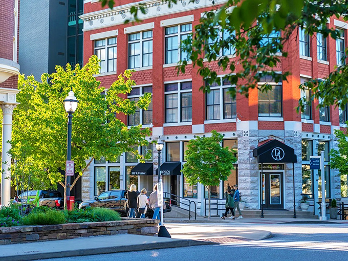 Downtown Fayetteville beckons with its brick charm and tree-lined streets – where college town energy meets small-town affordability.