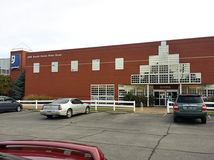 The brick fortress of bargains! Goodwill Outlet's imposing exterior hides a treasure trove where savvy shoppers fill carts by the pound.