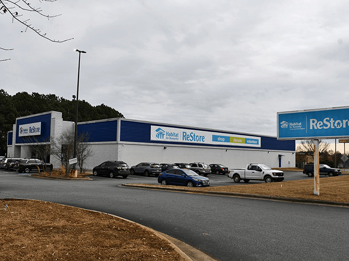 This massive ReStore warehouse stretches like an aircraft hangar filled with home improvement dreams and community spirit.