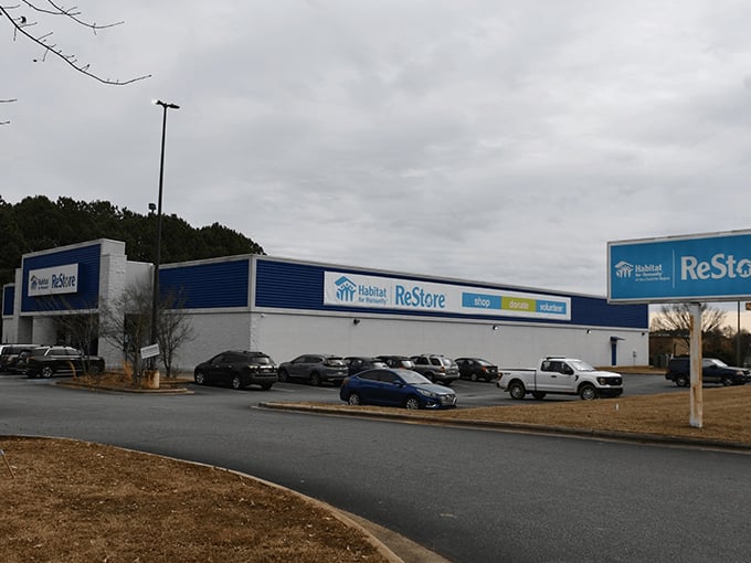 The blue and white Habitat ReStore stands like a treasure chest waiting to be unlocked. Bargain hunters' paradise!