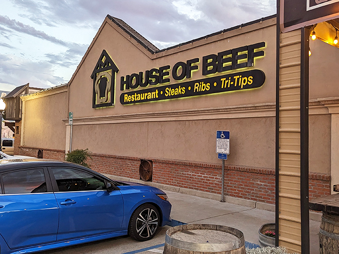 The House of Beef sign glows like a beacon for hungry travelers – a no-nonsense promise of what awaits inside.