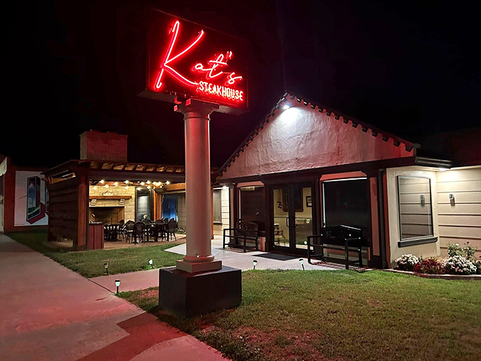 That neon sign isn't just advertising &ndash; it's a beacon of hope for hungry travelers seeking steak salvation.