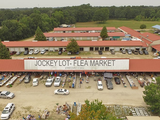 The aerial view of Lafayette Jockey Lot reveals a treasure hunter's paradise – red roofs sheltering endless possibilities and weekend dreams.