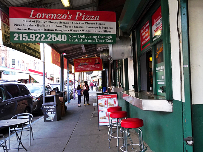 Lorenzo's Pizza: The sidewalk seating at Lorenzo's isn't fancy, but that green storefront promises pizza magic that'll make you forget your manners.